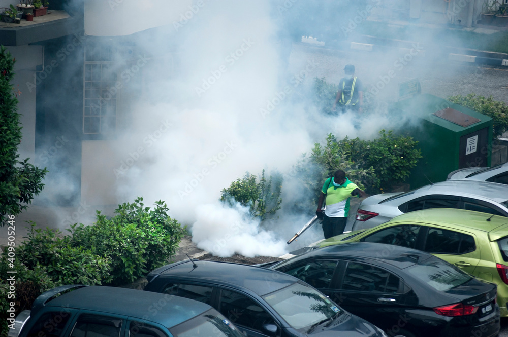 Healthcare worker using Fogging machine spraying chemical to eliminate ...