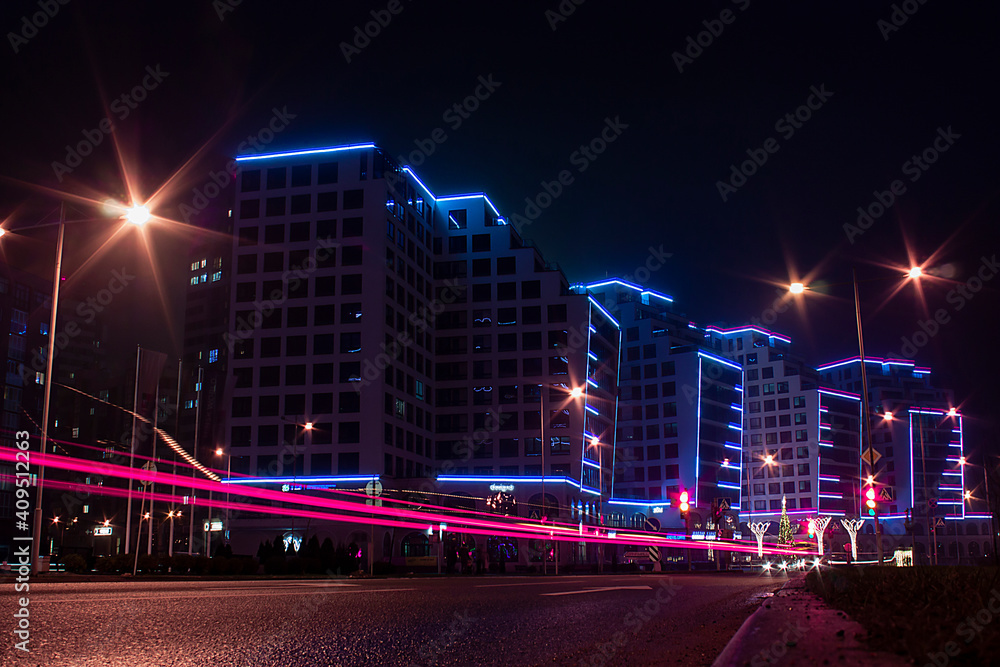 Horizontal long exposure nocturnal photography of night city street ...