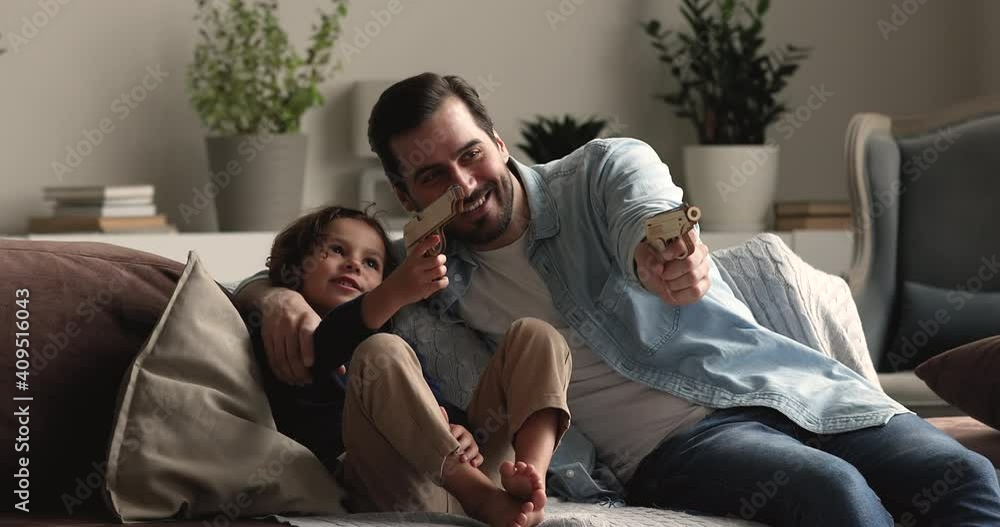Loving father play toy guns with little preschool adorable son, people ...