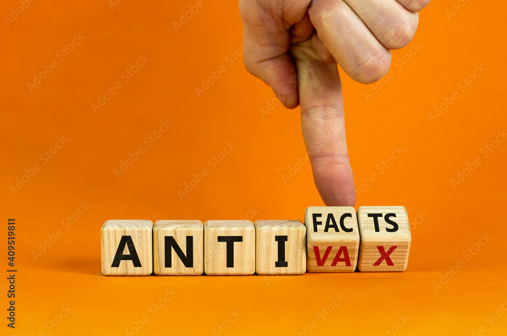 Anti-facts or anti-vax symbol. Doctor turns a cube, changes words 'anti ...