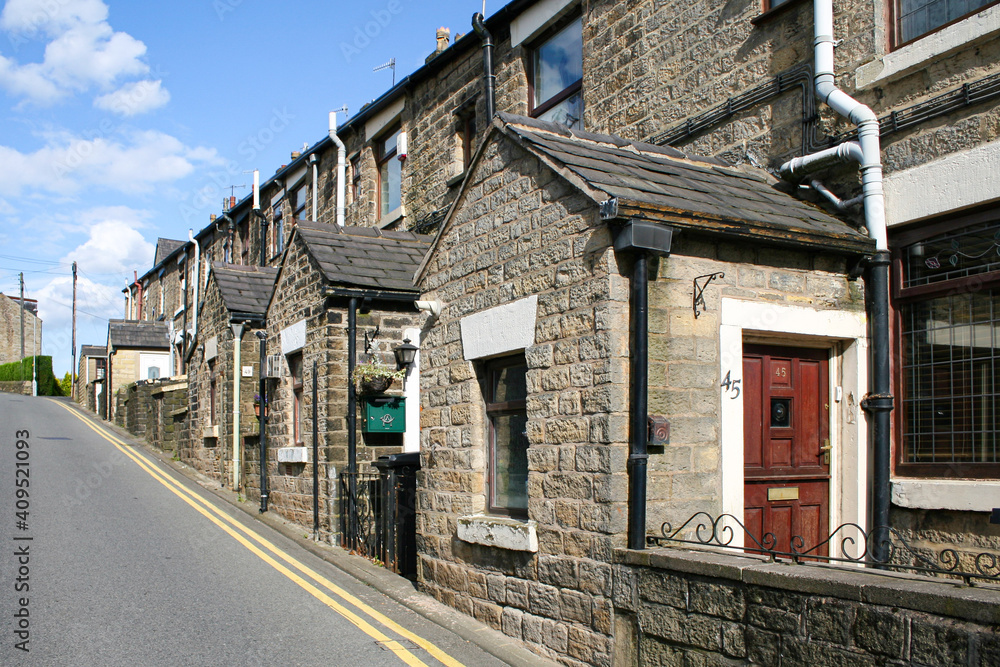 Mossley, England - A row of houses on a steep residential road in ...