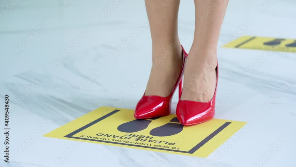 Women wearing red shoes standing distance of 1 meter from other people ...