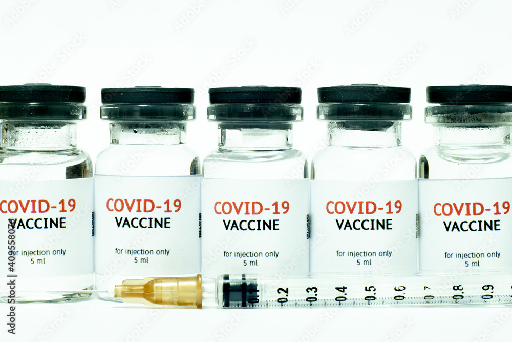 vials of covid-19 vaccine in a row with syringe Stock Photo | Adobe Stock