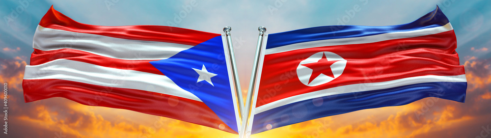 North Korea Flag and Puerto Rico flag waving with texture sky Cloud and ...