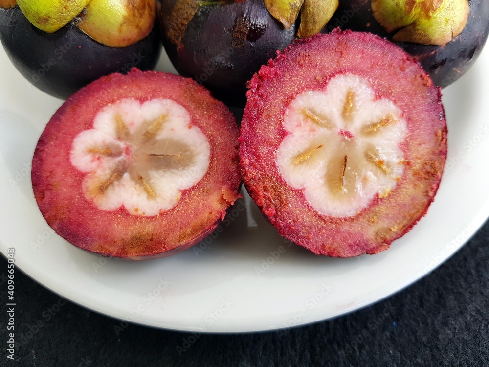 Mangosteen (Garcinia mangostana), also known as the purple mangosteen ...