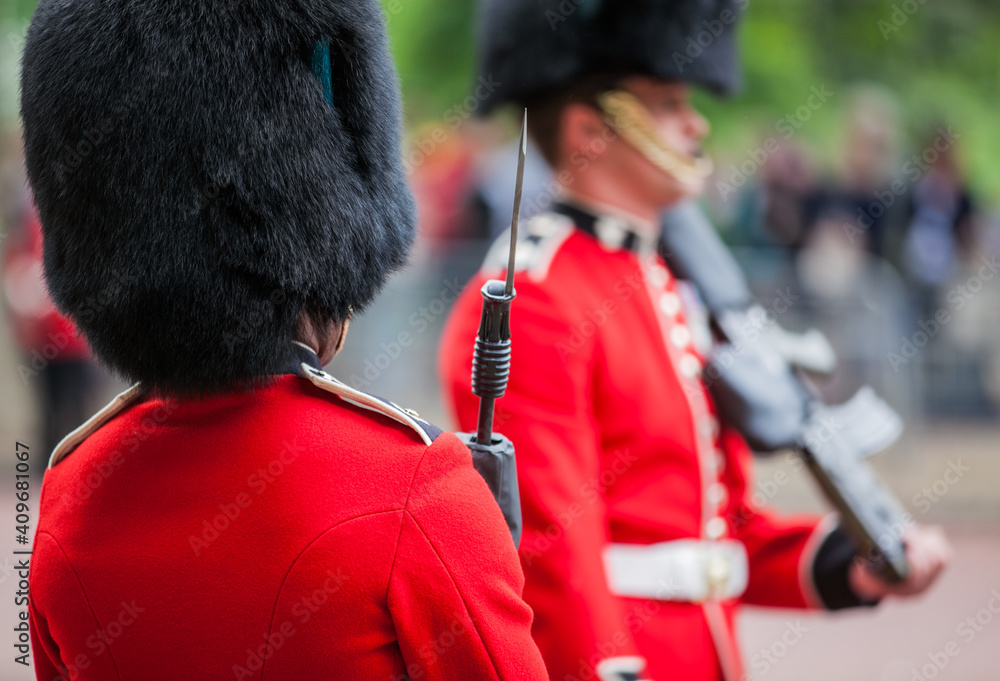British army guard in red tunic and bearskin on parade at the Trooping ...
