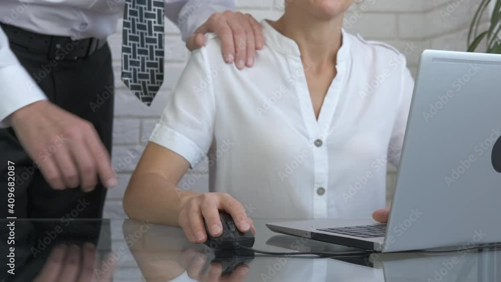 Flirt and harassment. A boss help woman with computer work and flirt ...
