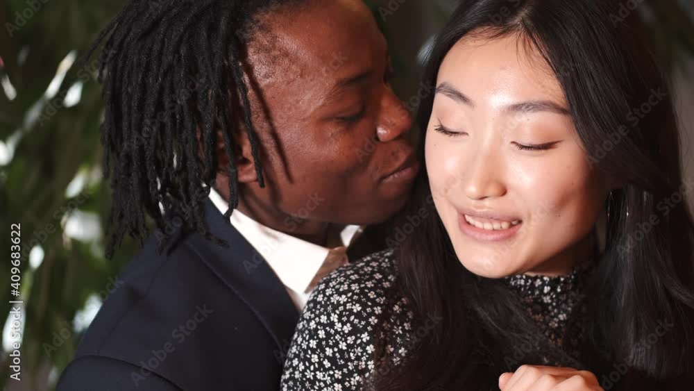 man giving a gift to his lover hugging her and drinking wine with each other couple woman young ...