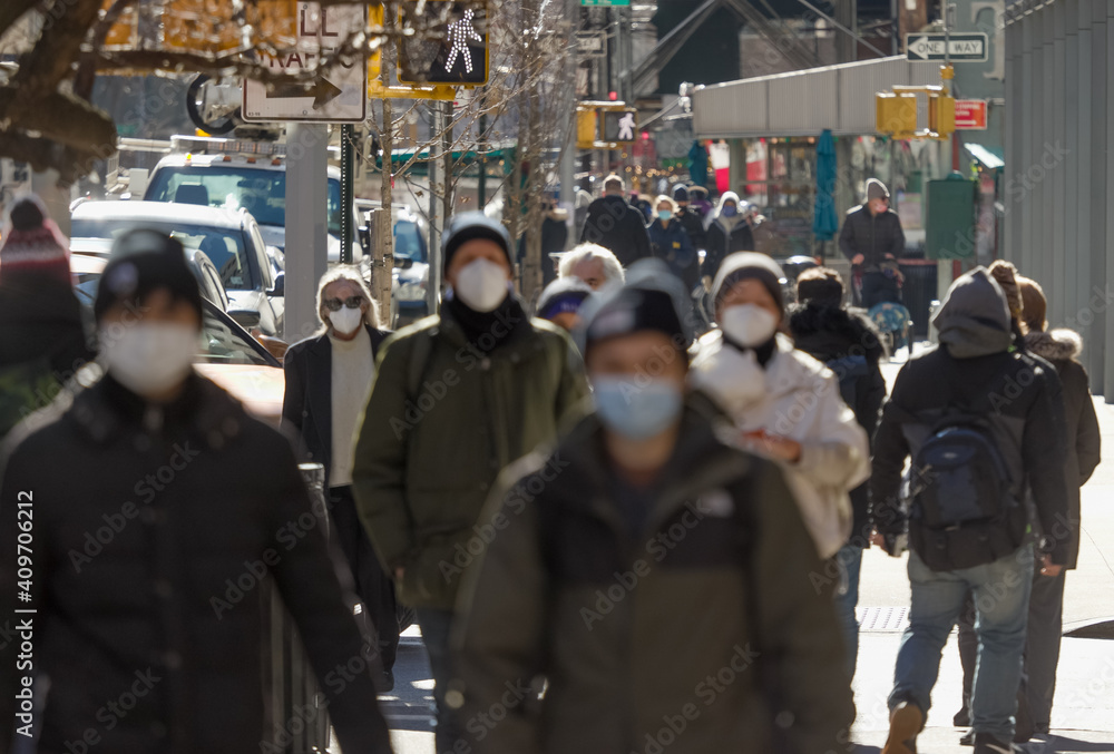 Crowd of people walking street wearing masks during covid 19 ...