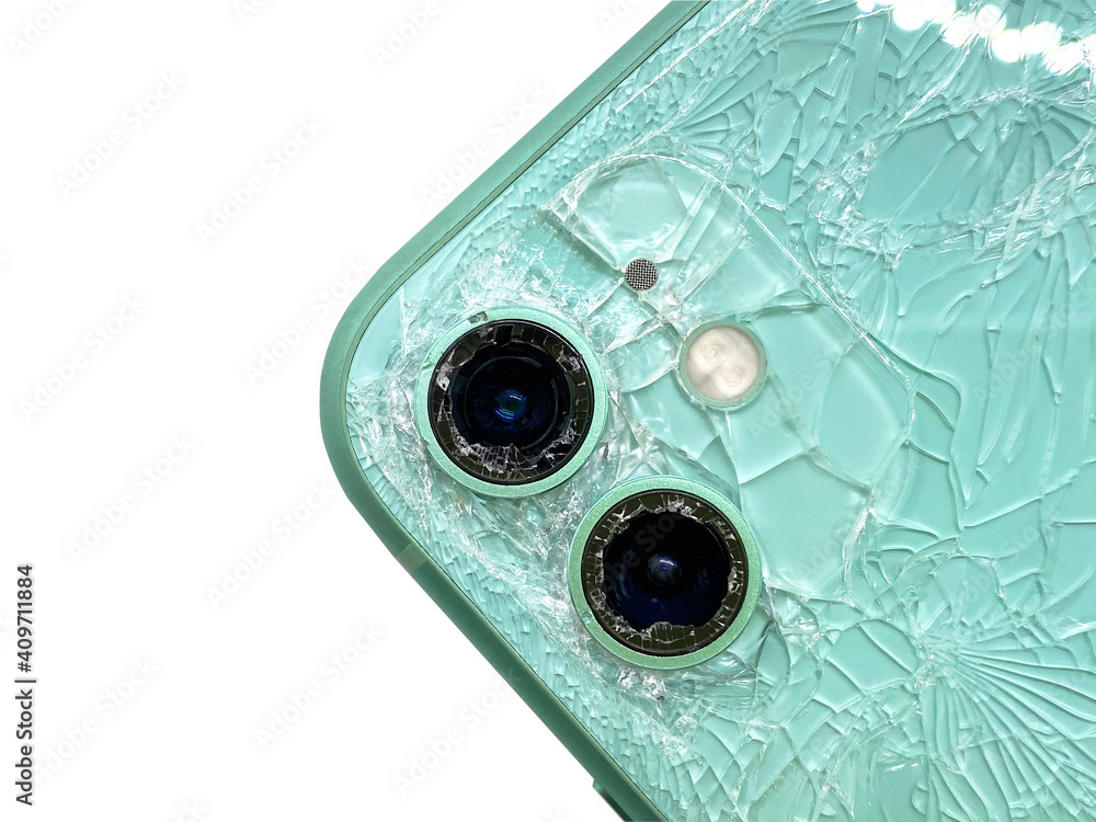 Top view the back of green modern smartphone with a broken glass and a ...