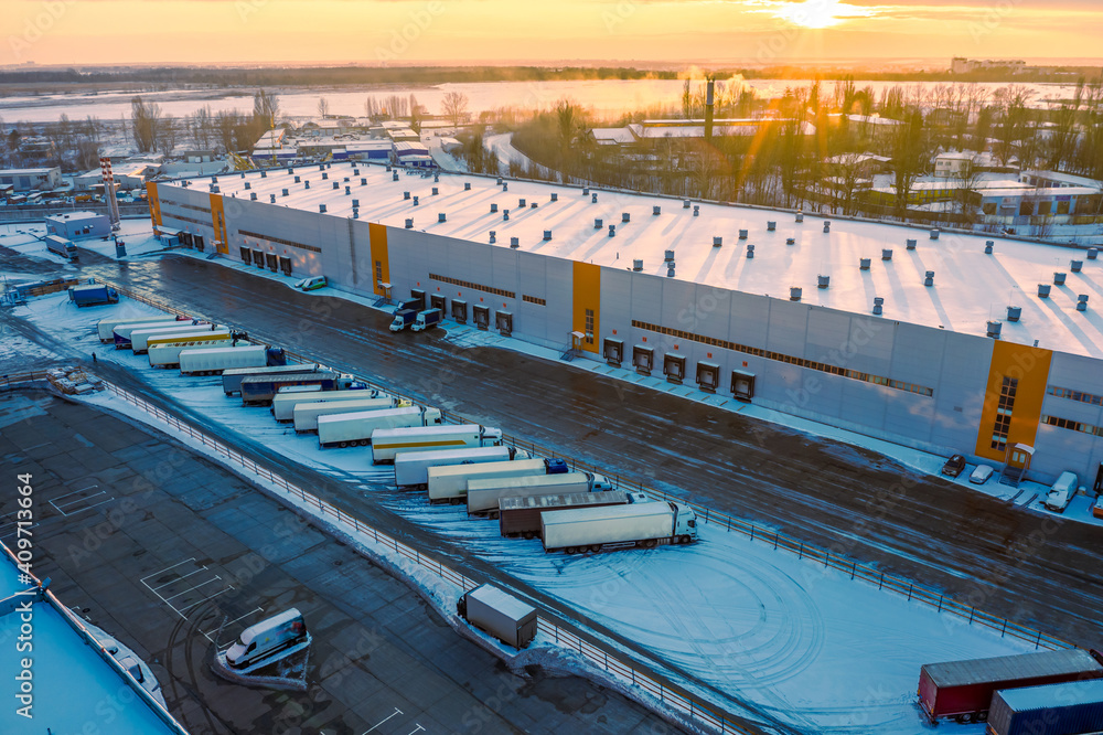 Logistics park with a loading hub. A lot of semi-trailer trucks stand ...