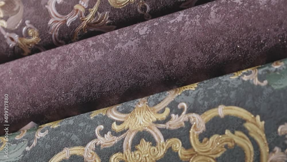 Sample in the store. Stands with rolls of wallpaper samples in the ...