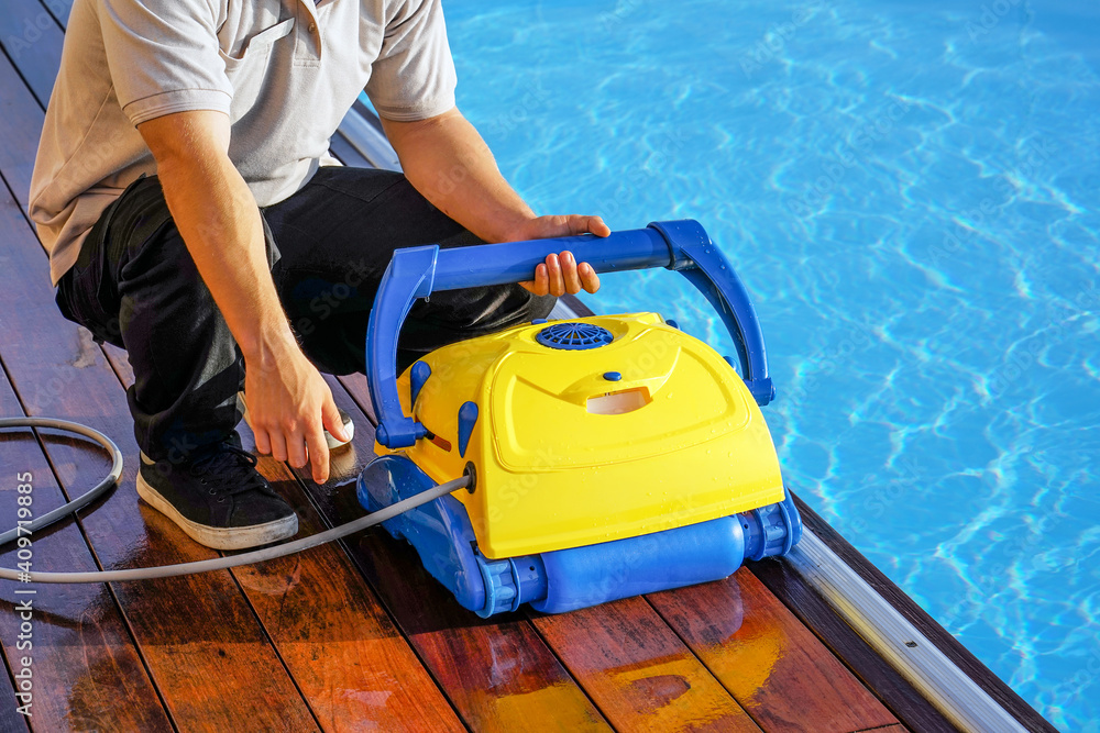 Pool cleaner during his work. Cleaning robot for cleaning the botton of ...