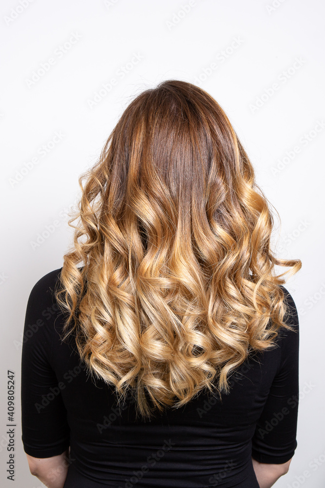 Back part of the hair of a young blond haired woman with balayage ...
