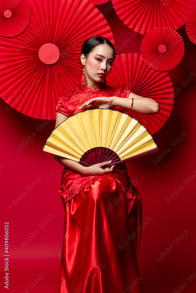 Beautiful glamourous Asian woman in traditional Chinese dress with ...