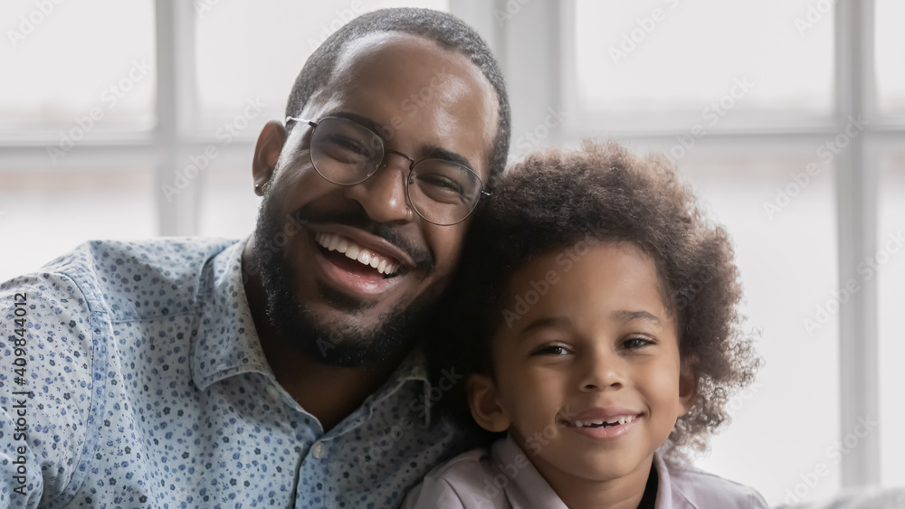 Head shot portrait overjoyed African American father wearing glasses ...