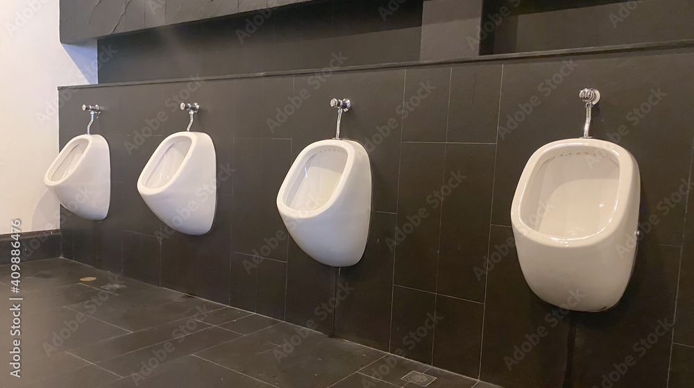 Men's white urinals design, Close up row of outdoor urinals men public ...