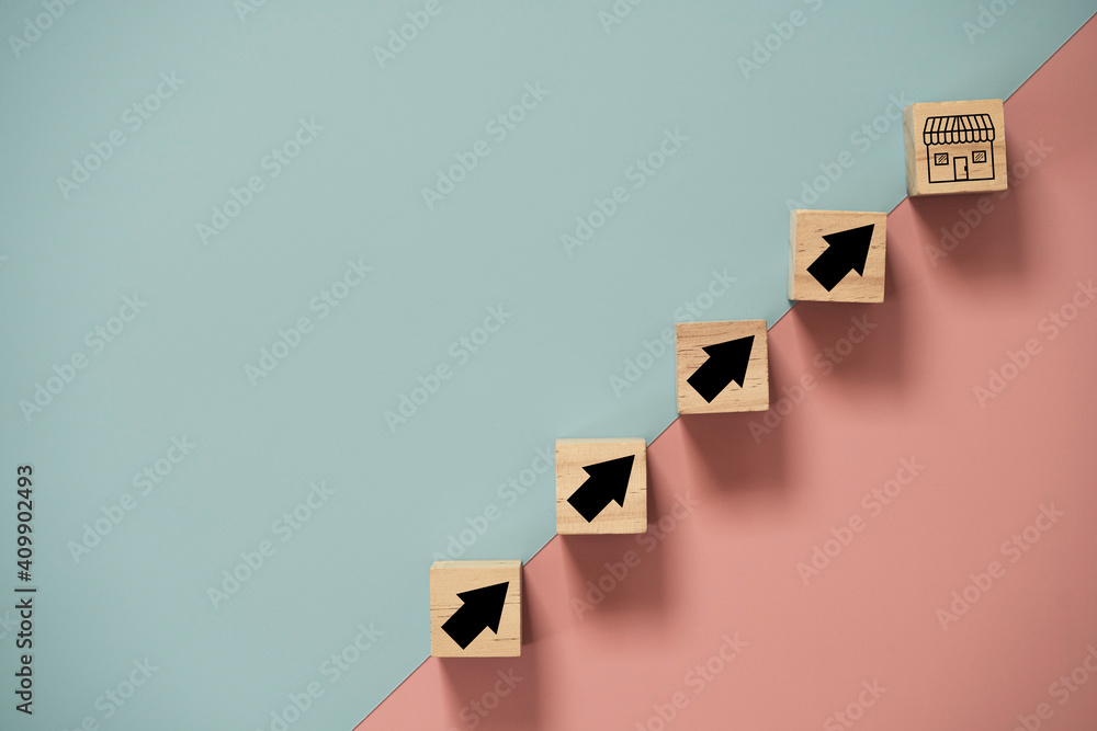 Shopping store and up arrow print screen on wooden block cube on white ...