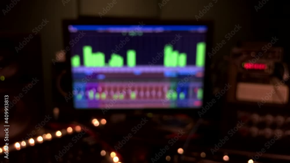 A dark and blurred sound recording studio type background with moving ...
