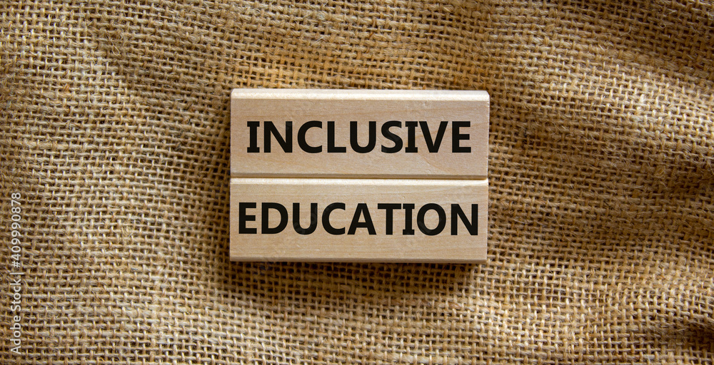 Inclusive education symbol. Wooden blocks form the words 'inclusive ...