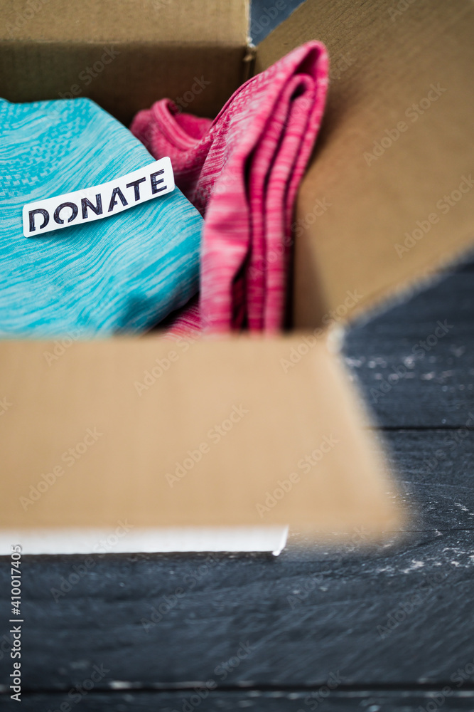 box with Donate label with second-hand items to be given away, charity ...