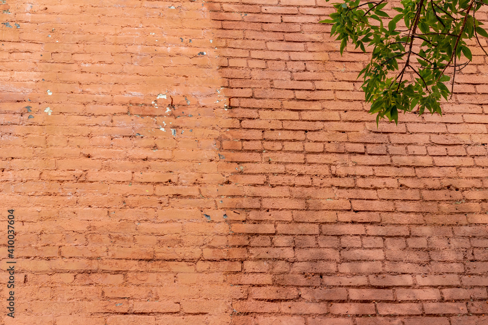 Shabby chic close up view of an old deteriorating rust color brick wall ...