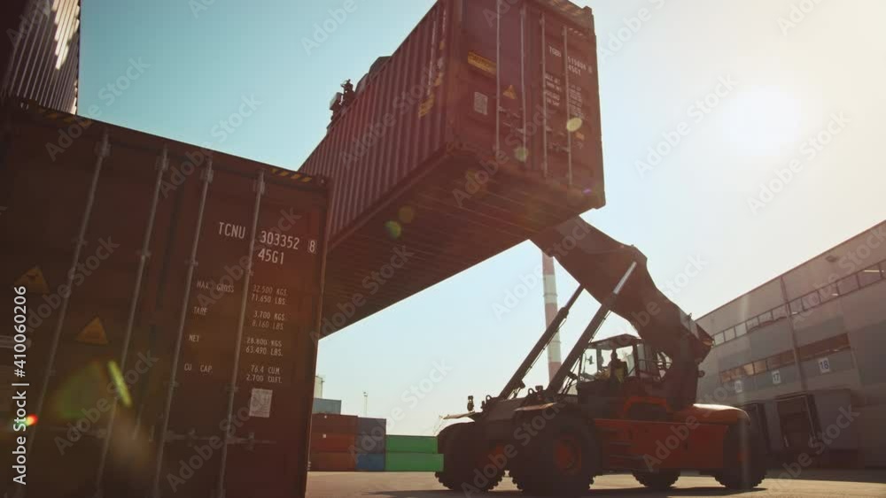 Modern Container Handler Carrying a Large Red Steel Shipping Cargo ...
