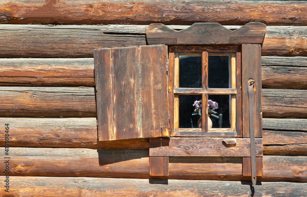 casement window on an old log wall. window of the village hut Stock ...