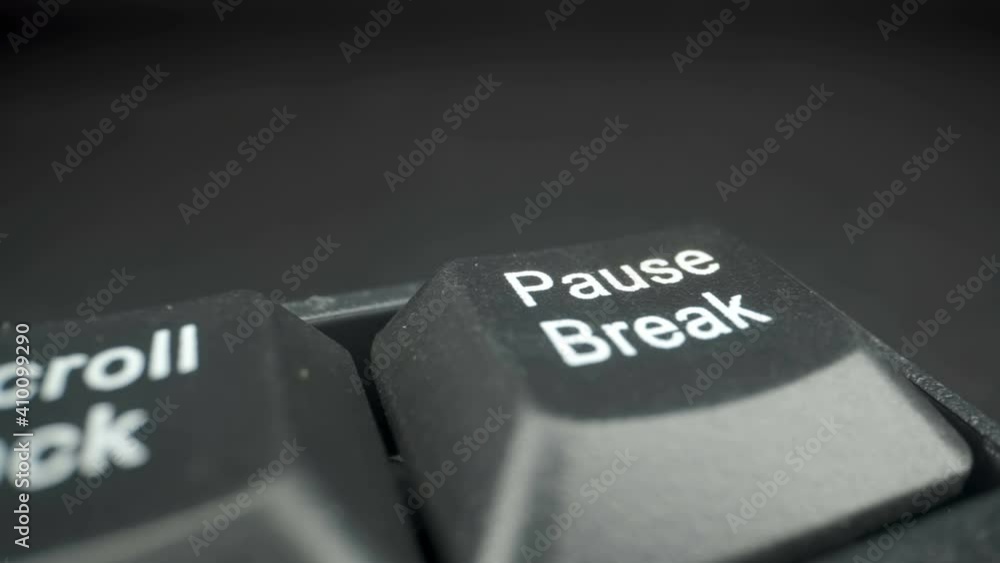 Closer look of the Pause Break key of the keyboard and pressing it once ...