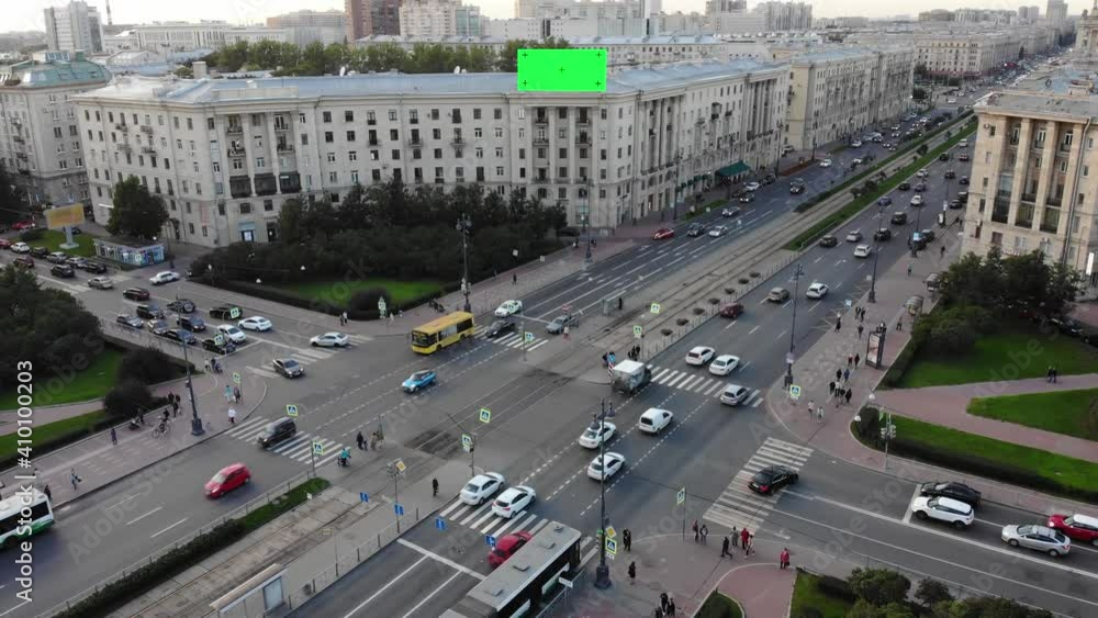AERIAL. Top view of skyscrapers and green screen build board with ...