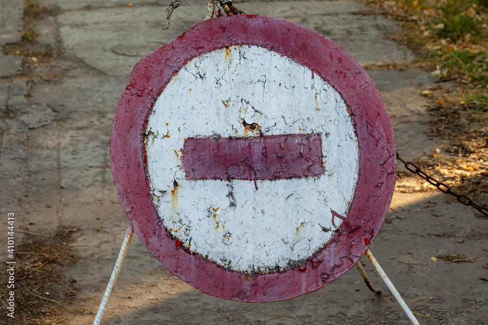 Old cracked shabby road sign Passage closed. Brick is a road sign that ...
