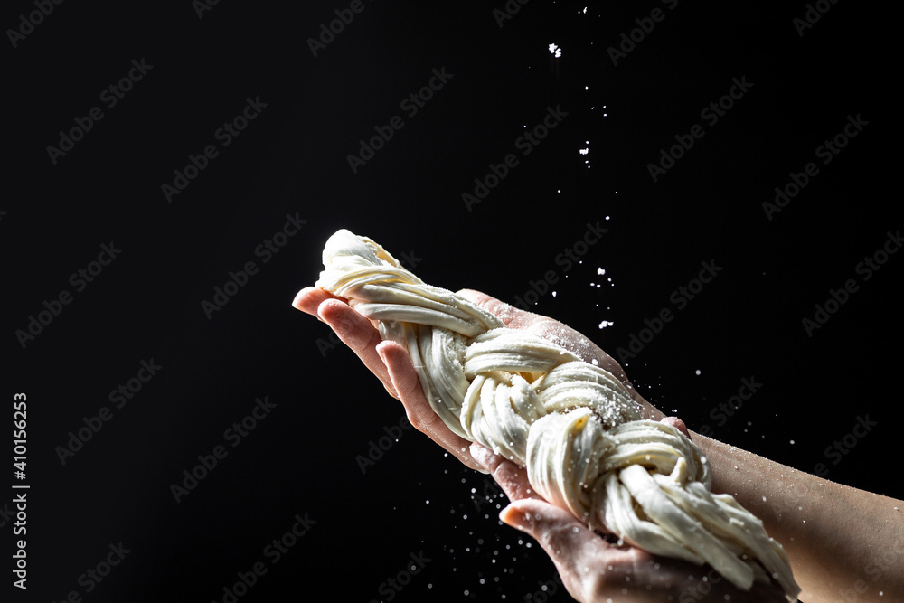A cheesemaker prepares a form of mozzarella cheese silano or ... A cheesemaker prepares a form of mozzarella cheese silano or ...