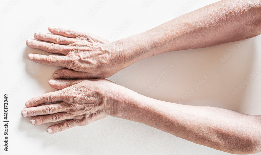 Old man's wrinkled hands and arms on white grounds. Stock Photo | Adobe ...