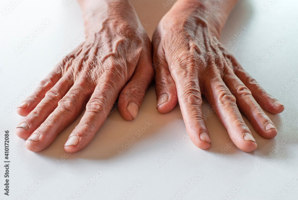 Old man's wrinkled hands on white grounds Stock Photo | Adobe Stock