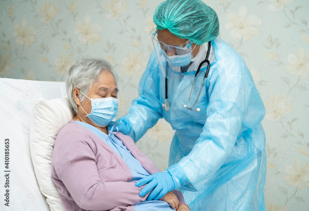 Asian doctor wearing face shield and PPE suit new normal to check ...