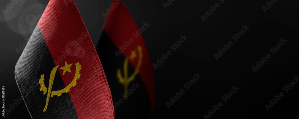 Small national flags of the Angola on a dark background Stock Photo ...