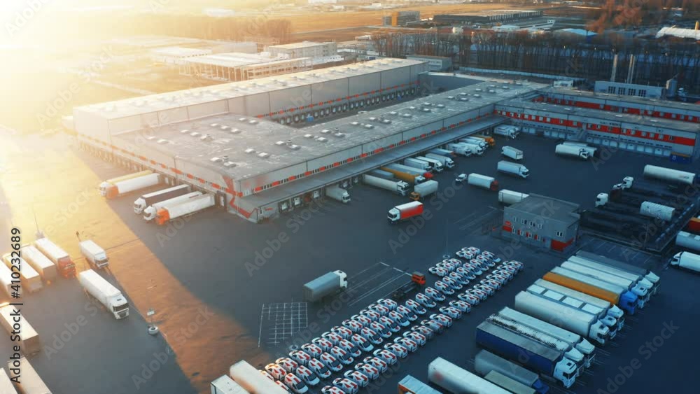 Logistics park with a warehouse and loading hub. Semi-trailer trucks ...