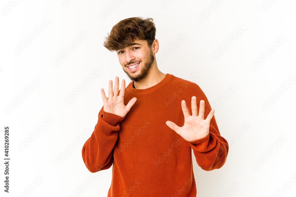 Young arab man on white background rejecting someone showing a gesture ...