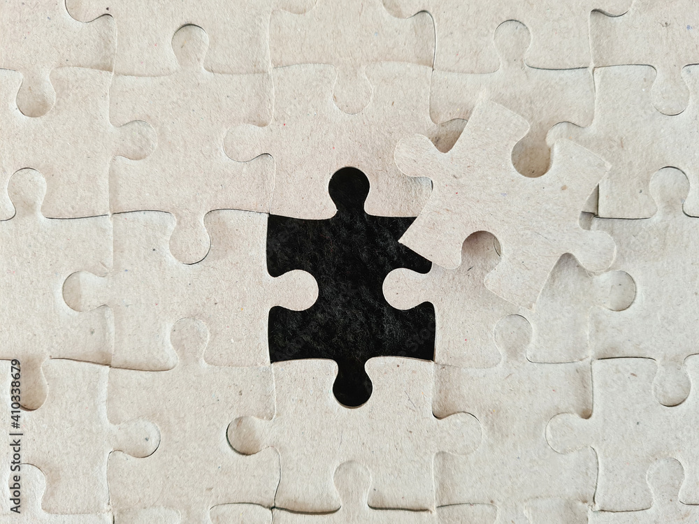 One piece of the puzzle being completed. Stock Photo | Adobe Stock