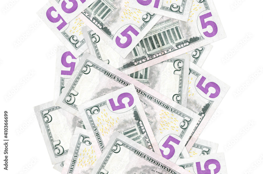 5 US dollars bills flying down isolated on white. Many banknotes ...