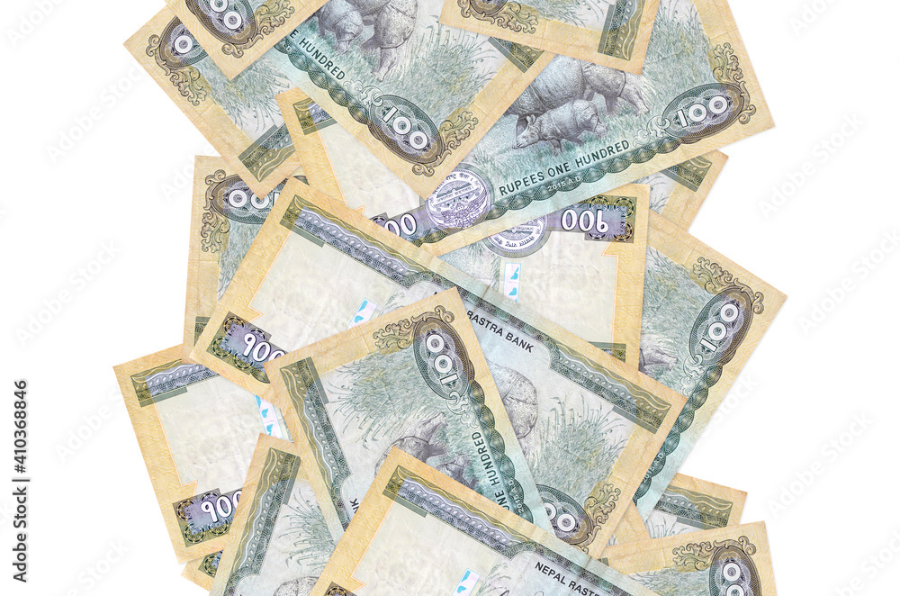 100 Nepalese rupees bills flying down isolated on white. Many banknotes ...