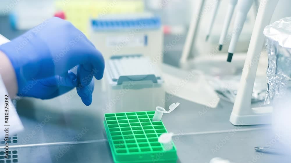 Virus research concept. Laboratory worker works with covid-19 samples ...