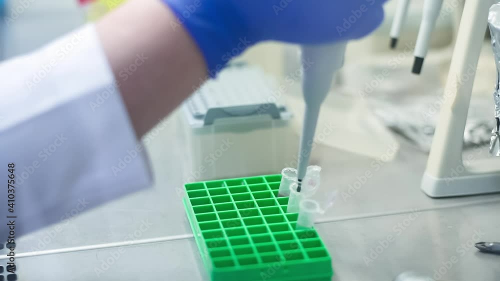 Virus research concept. Laboratory worker works with covid-19 samples ...