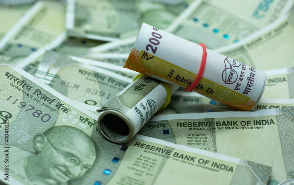 Indian Currency Rupees. Rolls of 500 and 200 Indian rupee money ...