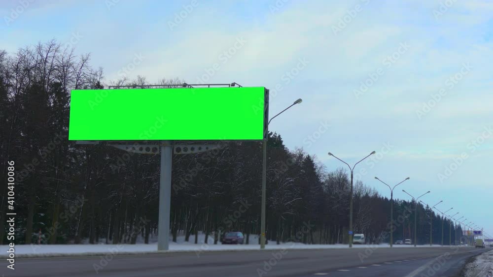 Mock up concept. Blank green screen billboard on a winter highway ...
