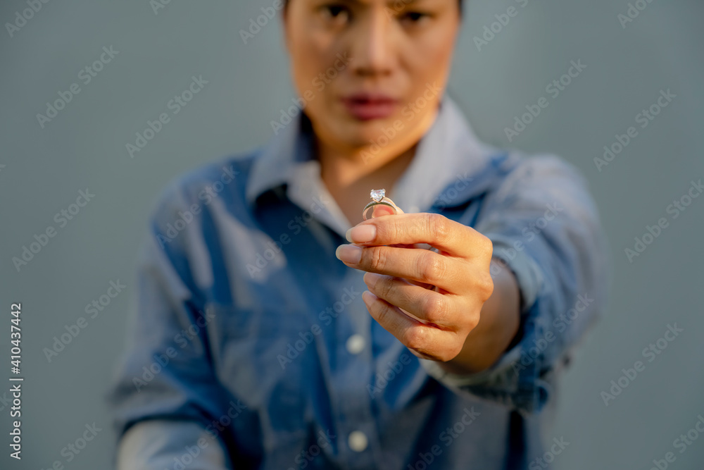 Sad Wife Take off the diamond wedding ring from finger. Quarrel fight ...