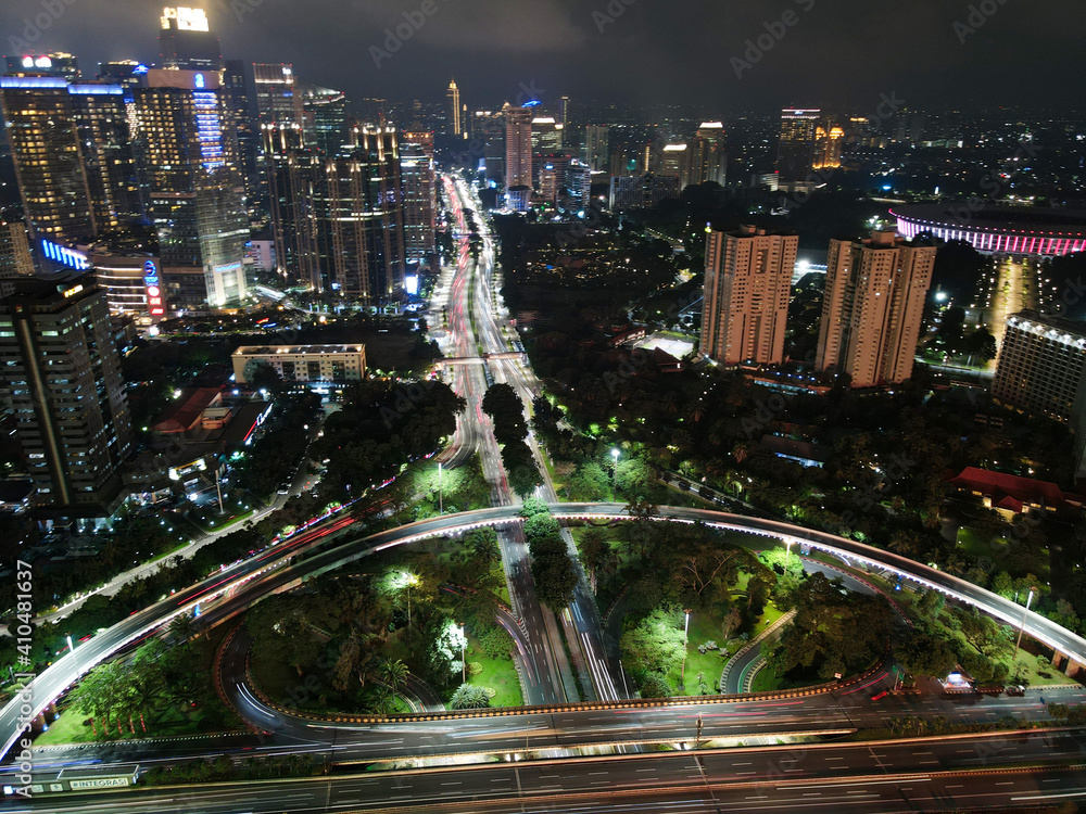 Spectacular nighttime skyline of a big modern city at night. Semanggi ...