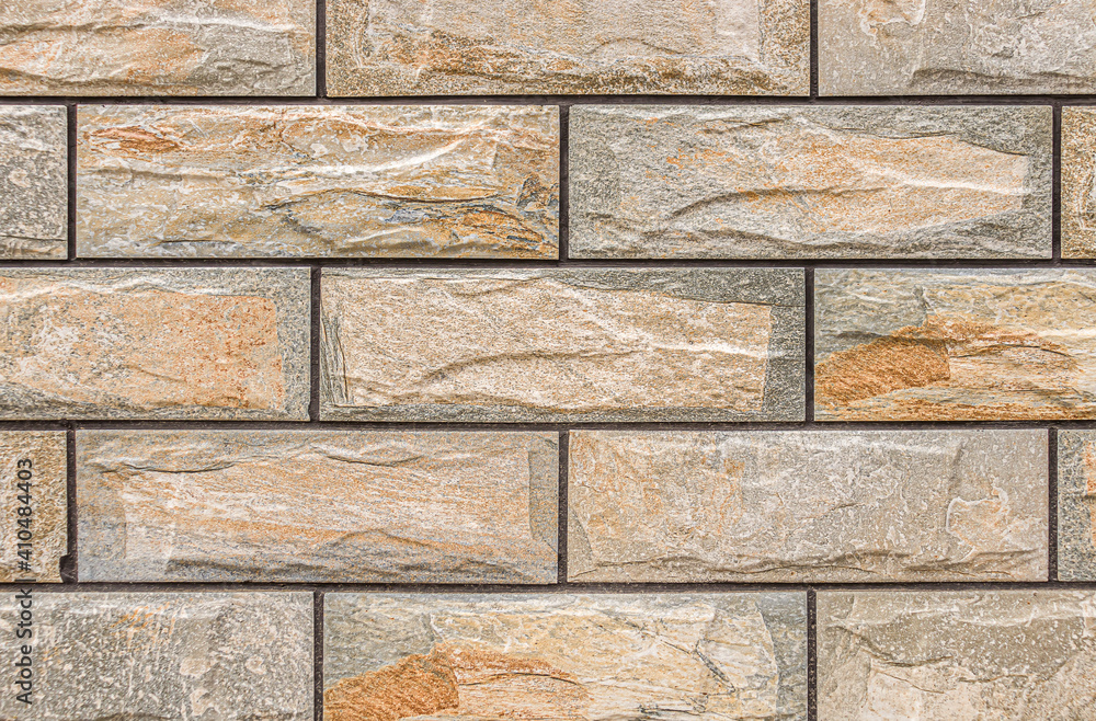 Wall from natural stone tiles. Stone texture. Stock Photo | Adobe Stock