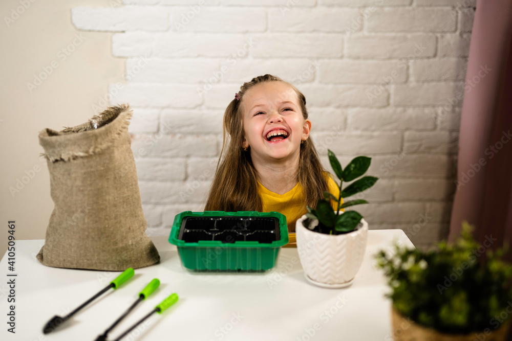 happy child girl planting flower seeds. Gardening, planting concept ...