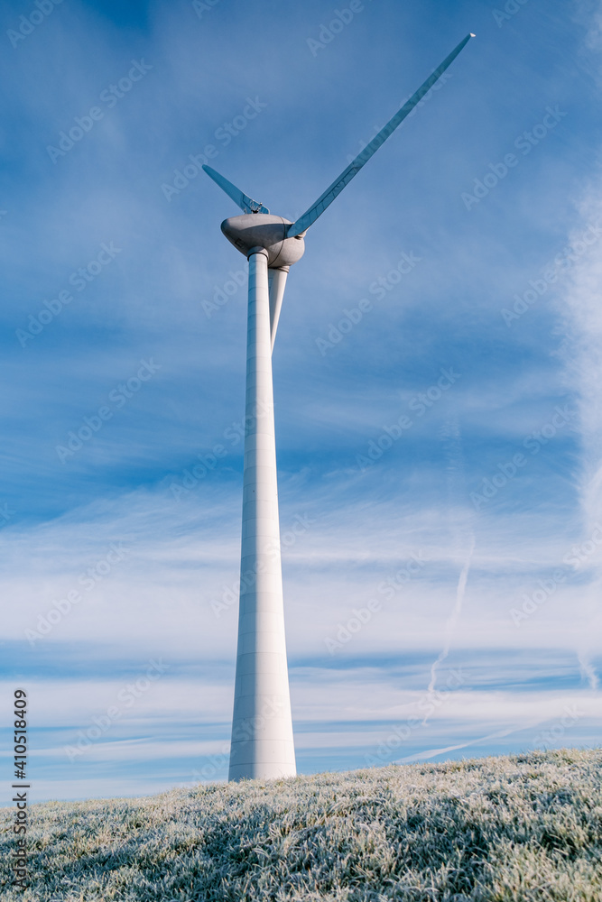 offshore windmill park with stormy clouds and a blue sky, windmill park ...